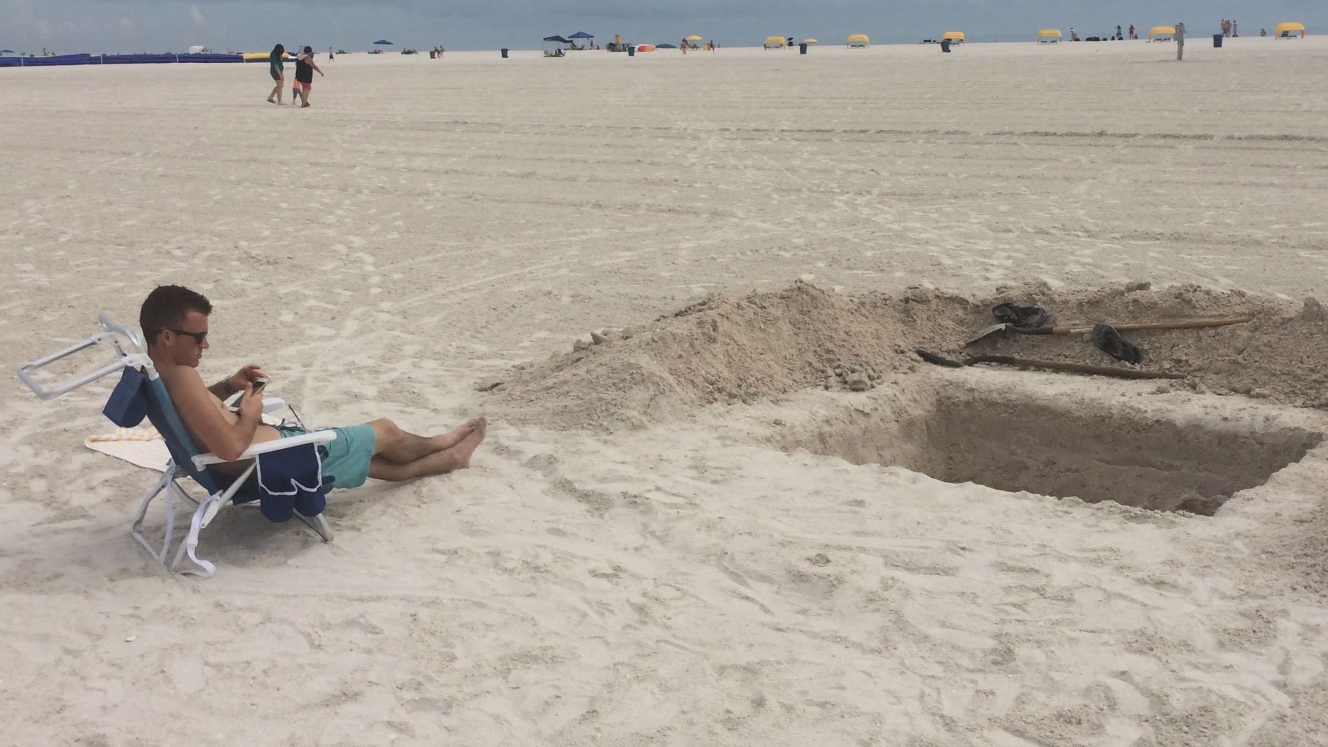 Digging A Hole At Beach